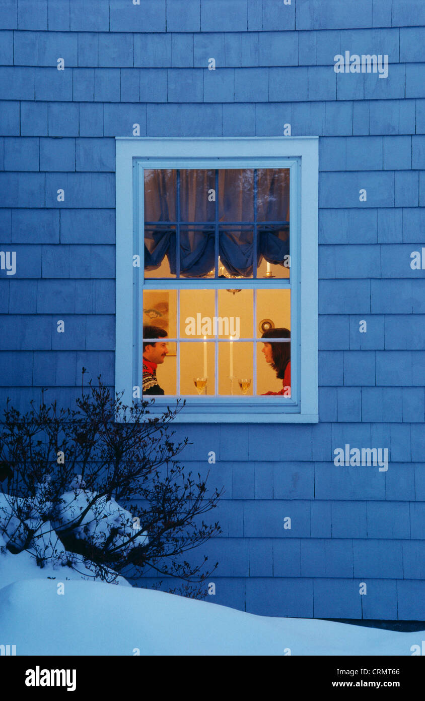 Couple dining inside on a cold snowy night Stock Photo - Alamy