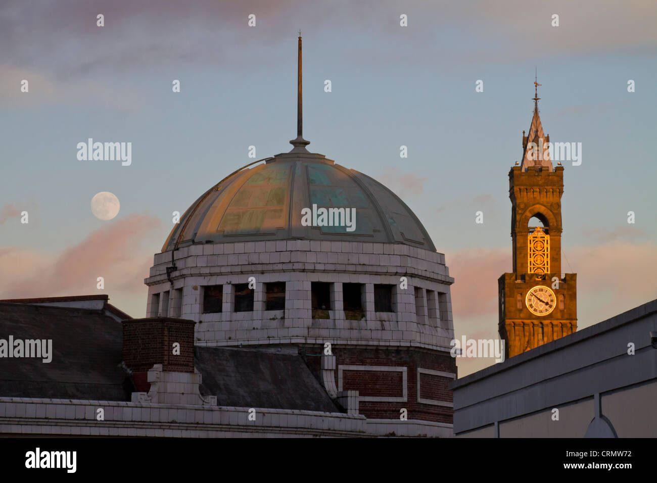 A full moon rising behind Bradford Odeon and Town Hall Stock Photo - Alamy