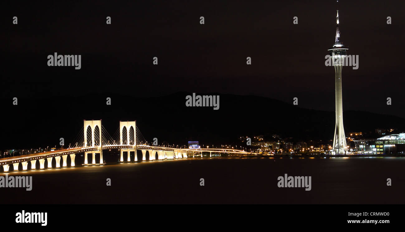 Cityscape in night with famous travel tower near river in Macao, China ...
