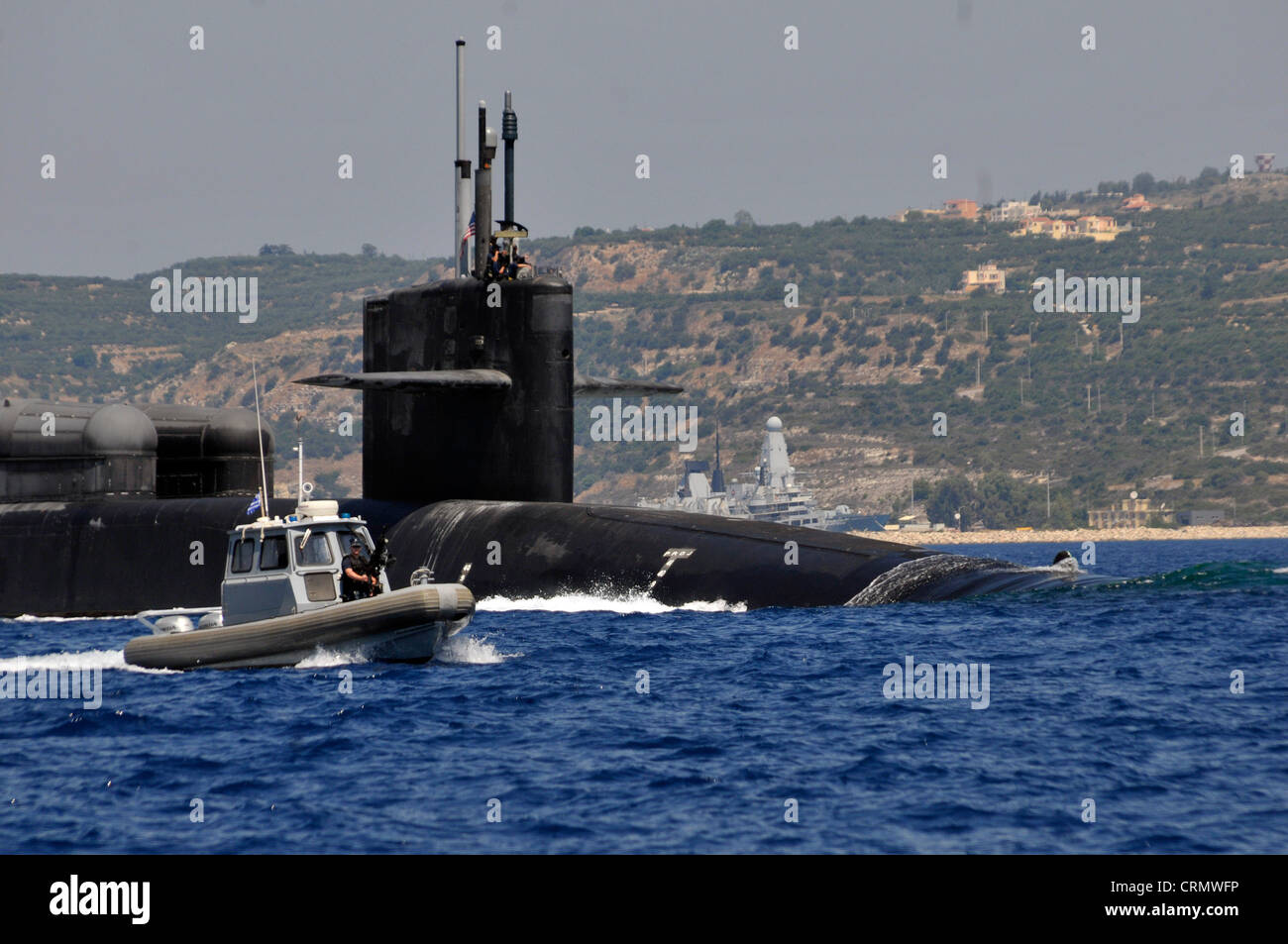 Ohio-class guided-missile submarine USS Florida (SSGN 728) is escorted ...