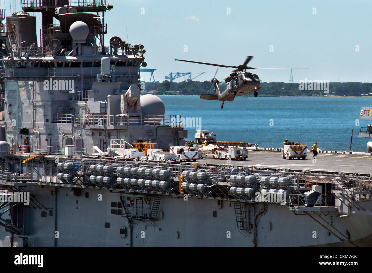 MH-60S Knight Hawk helicopter lands on the flight deck of the ...