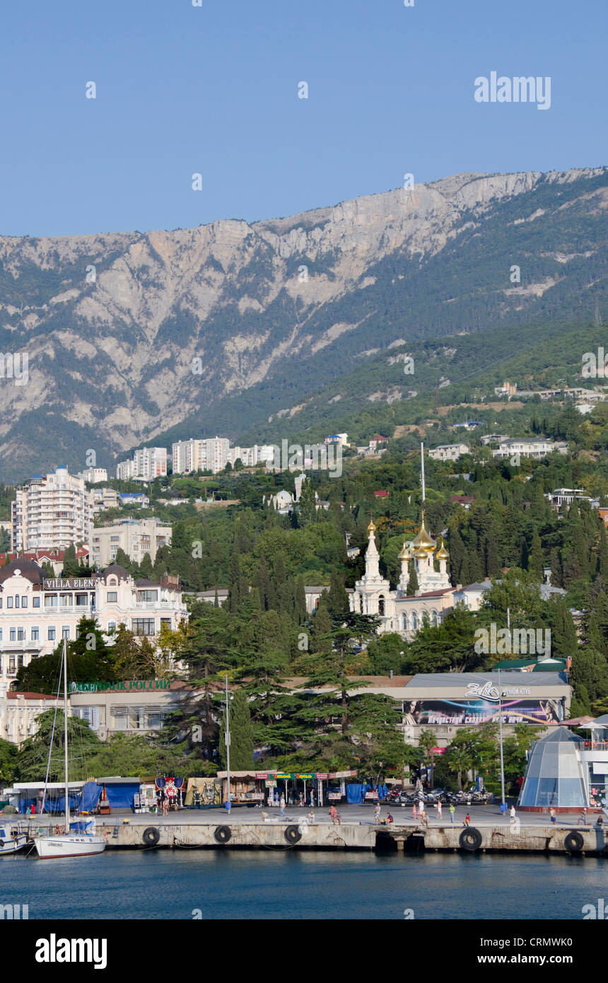 Ukraine, Yalta. Black Sea view of the port of Yalta with the Crimean ...