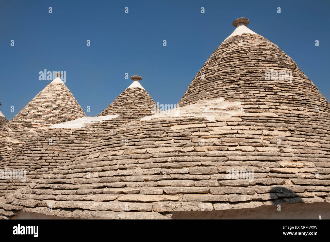 Conical dry stone rooves of trulli houses, Rione Monti, Alberobello ...