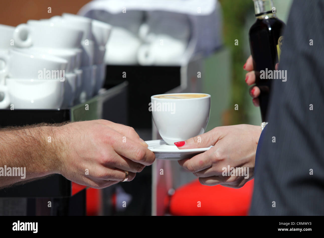 Hand over drink hi-res stock photography and images - Alamy