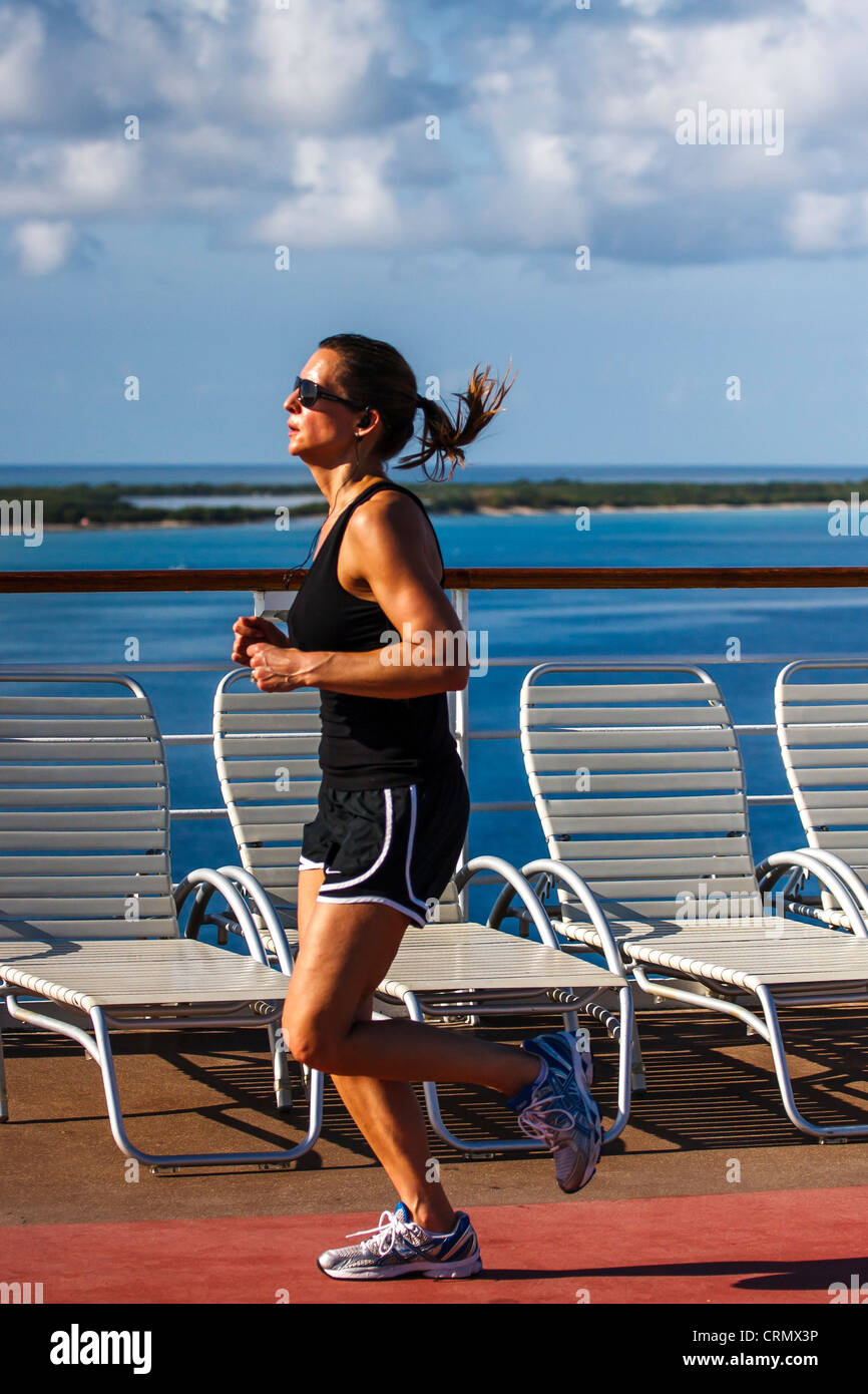 A woman running on the deck of a cruise ship Stock Photo - Alamy