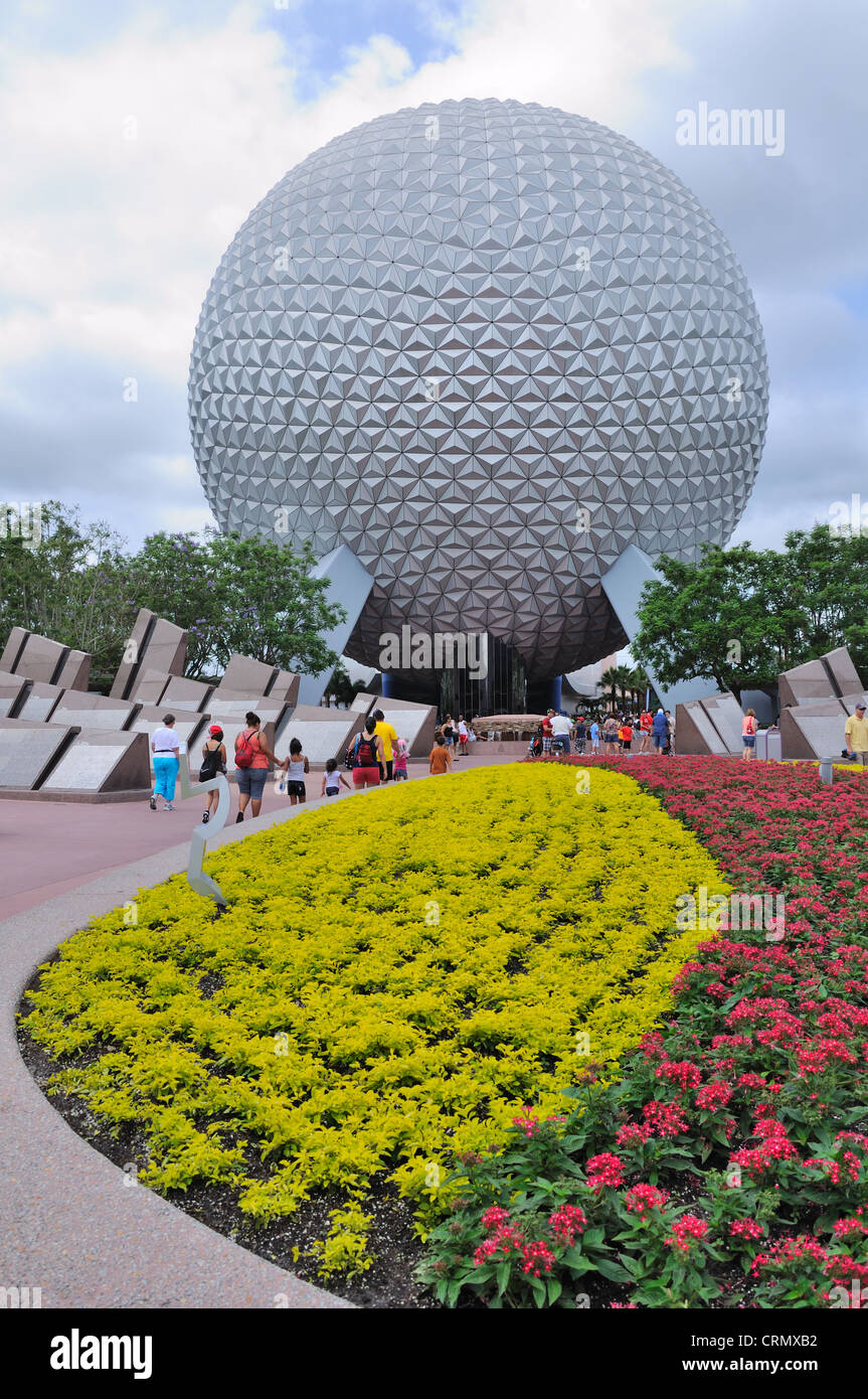 The Epcot polyhedron is the backdrop for a colourful bedding plant ...