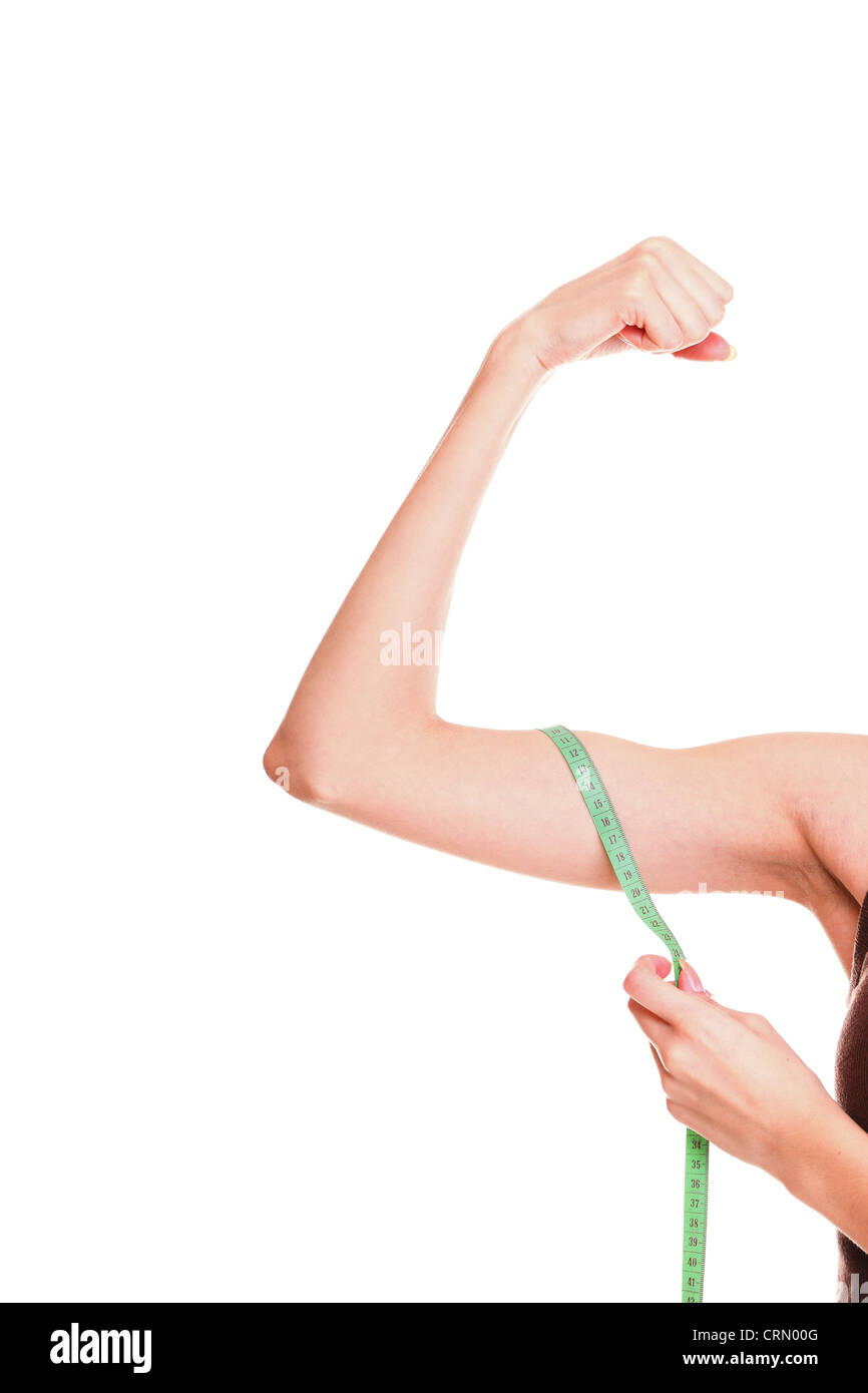 Beautiful young caucasian woman measuring her body with tape, isolated ...