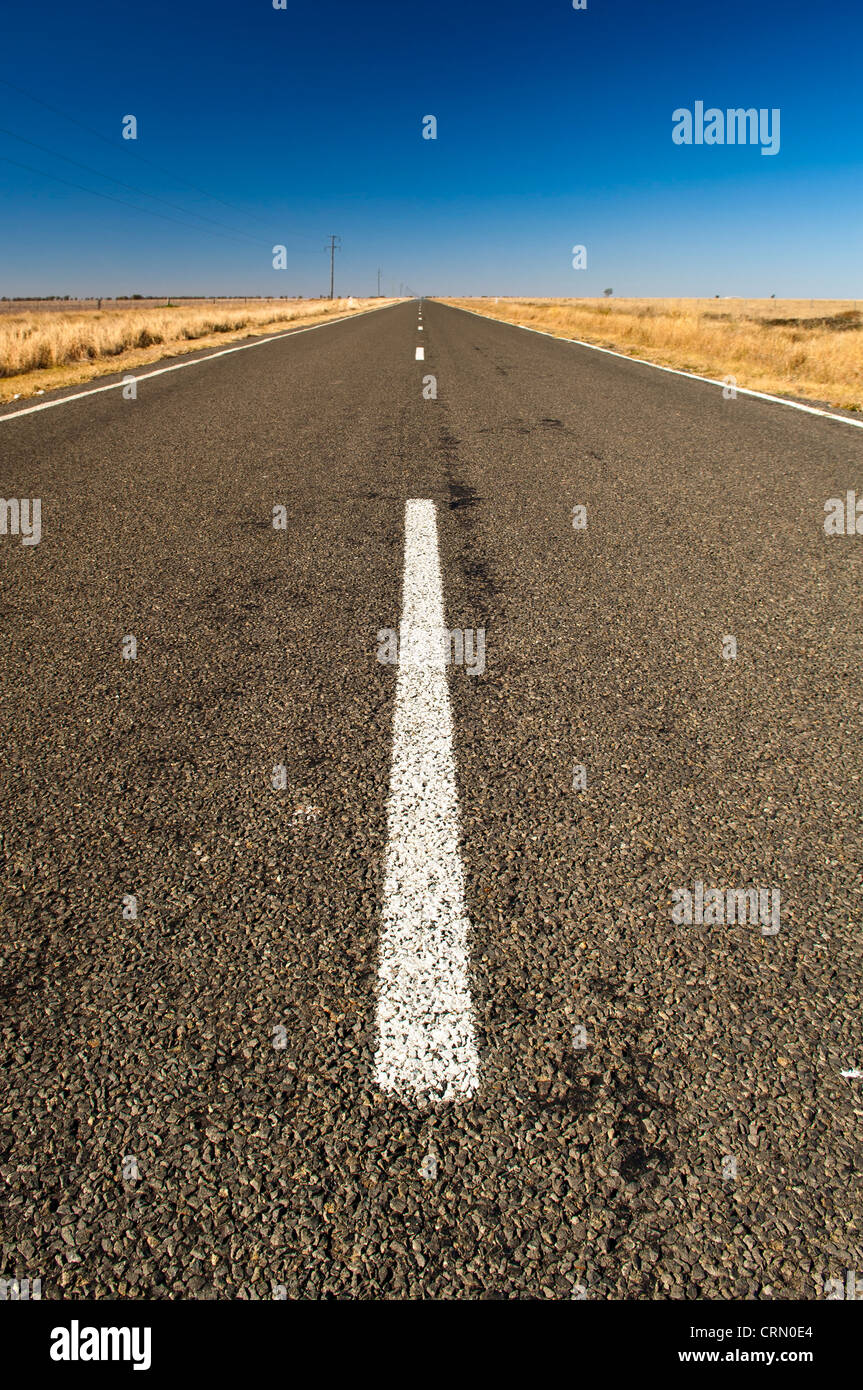 Road ahead on a wide country asphalt road with blue sky Stock Photo - Alamy