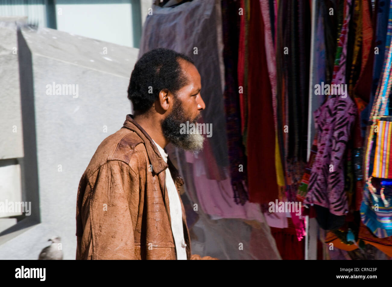 Ethnic homeless man walking on city street in San Francisco CA USA ...