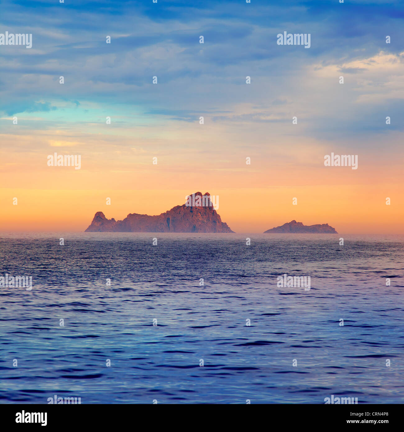 Ibiza sunset Es Vedra in Balearic islands view from Mediterranean sea ...