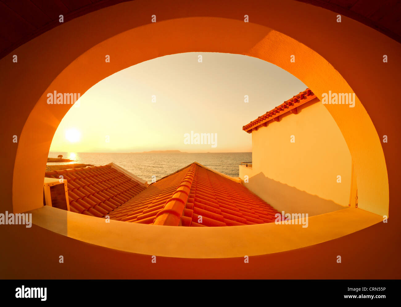 Sunset view through the arched window orange wall Crete Stock Photo - Alamy