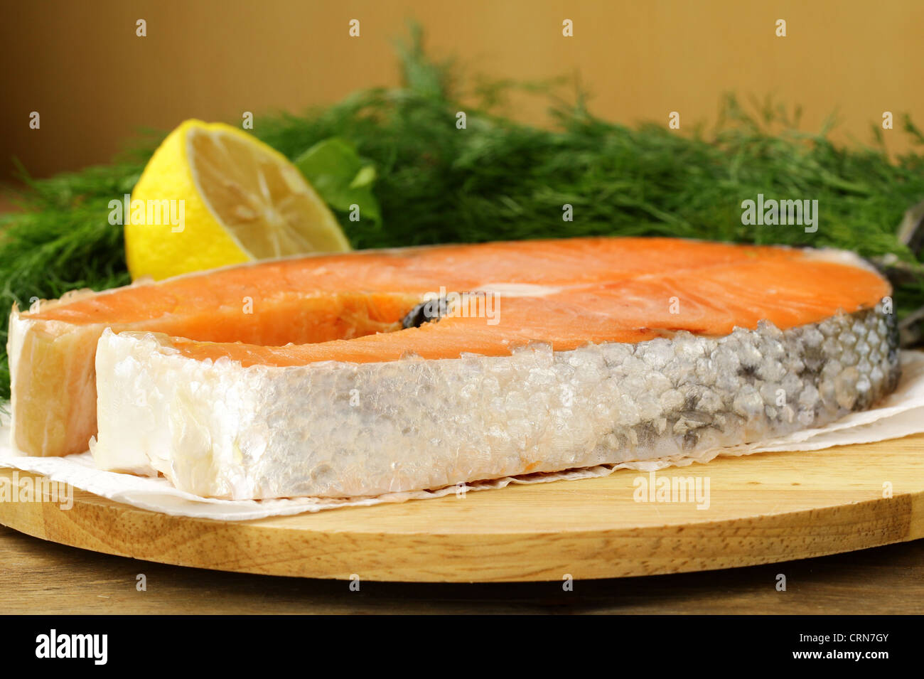 red delicatessen fish salmon with lemon and dill Stock Photo - Alamy