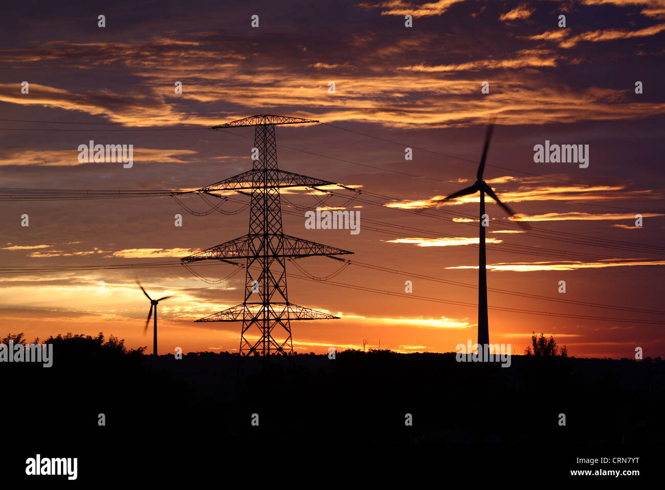 Windmills at sunrise Stock Photo - Alamy