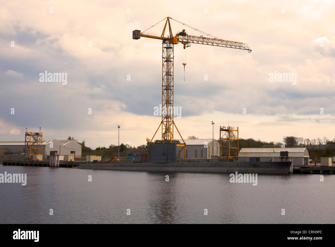 Old submarine and large crane at dock in Barrow in Furness Stock Photo ...