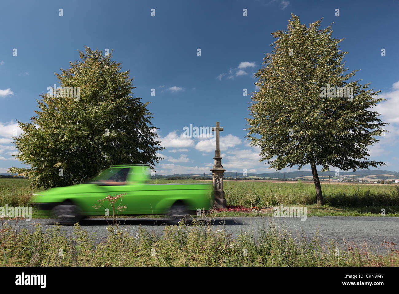 Speeding car in countryside Stock Photo - Alamy