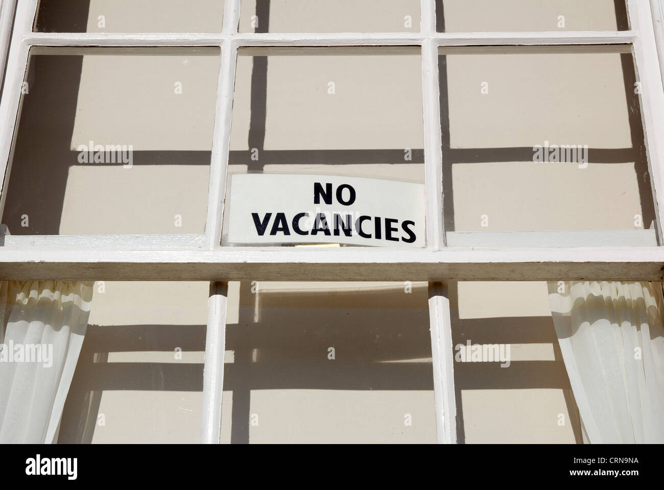 A no vacancies sign in a hotel window, blackpool, uk Stock Photo - Alamy