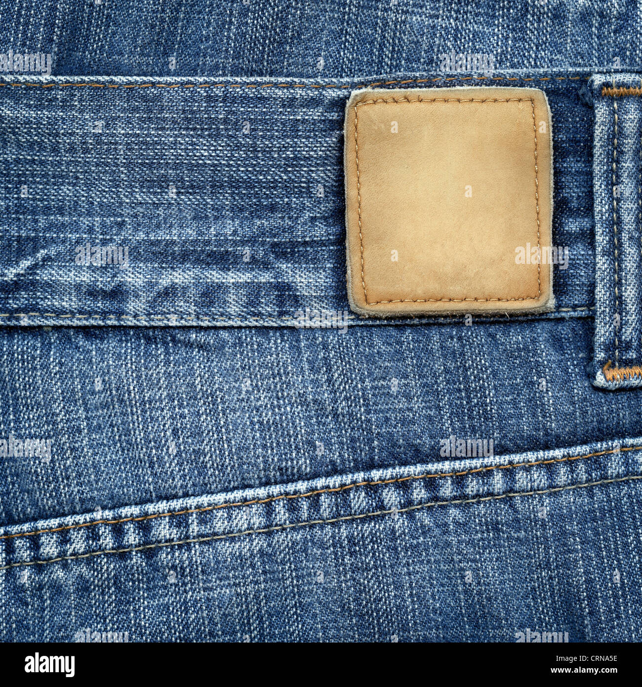 Blue jeans with blank leather label Stock Photo - Alamy