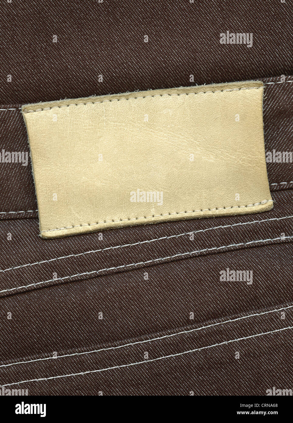 Blank leather label sewed on pants Stock Photo - Alamy