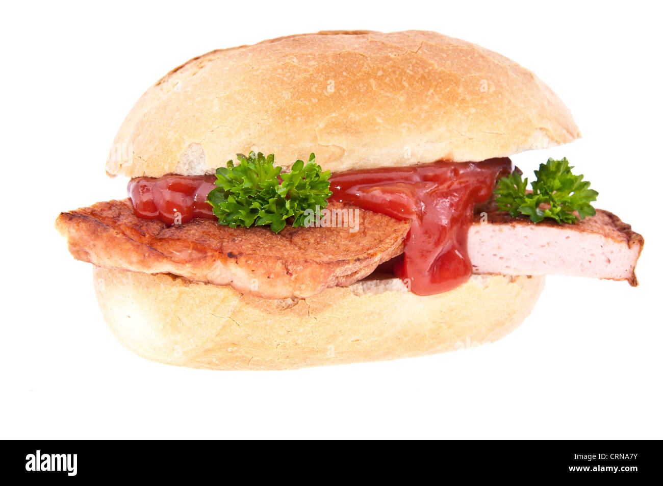 Meat loaf roll with parsley and ketchup isolated on white background ...