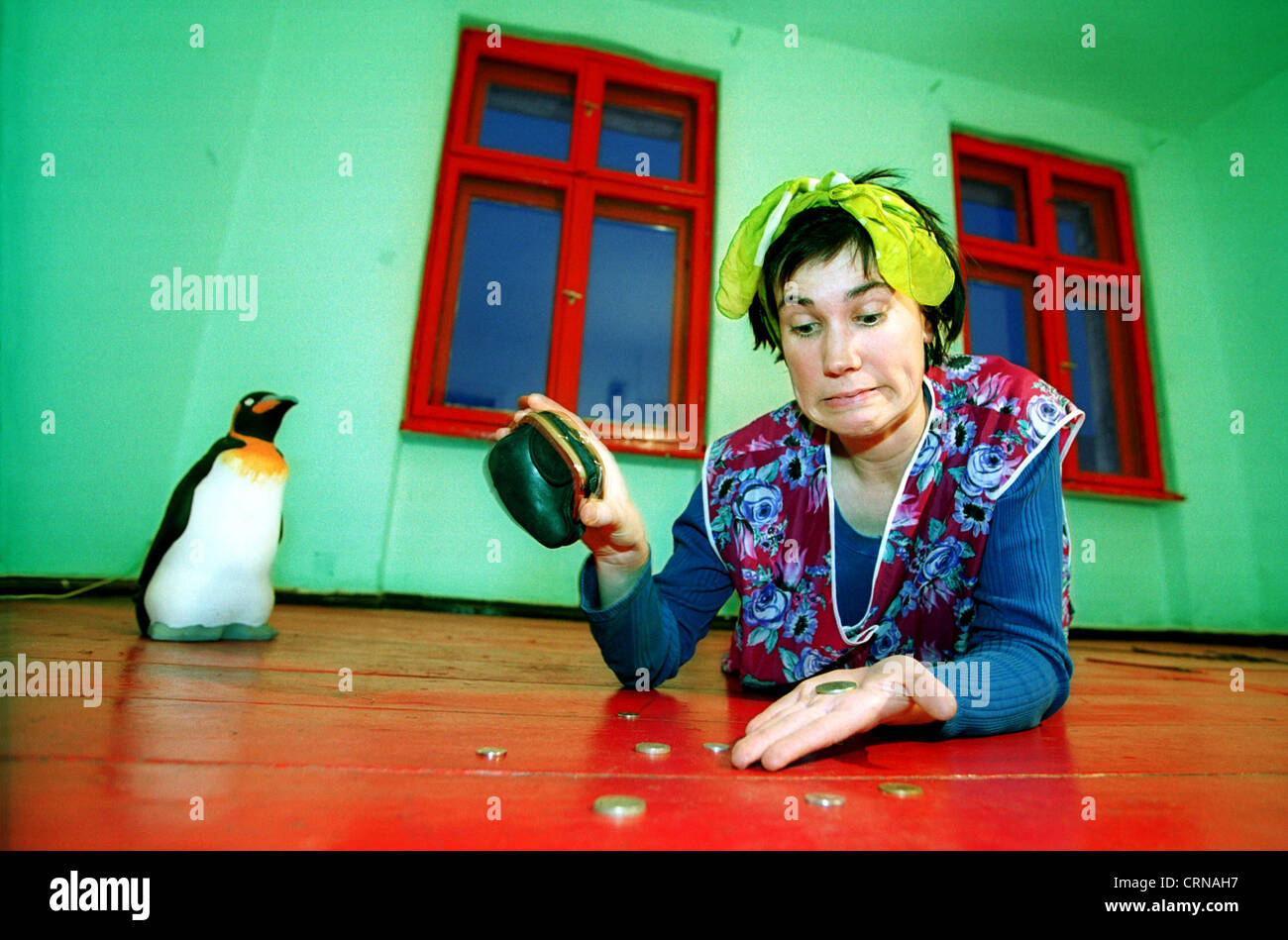Housewife collects the last money in an empty room Stock Photo - Alamy