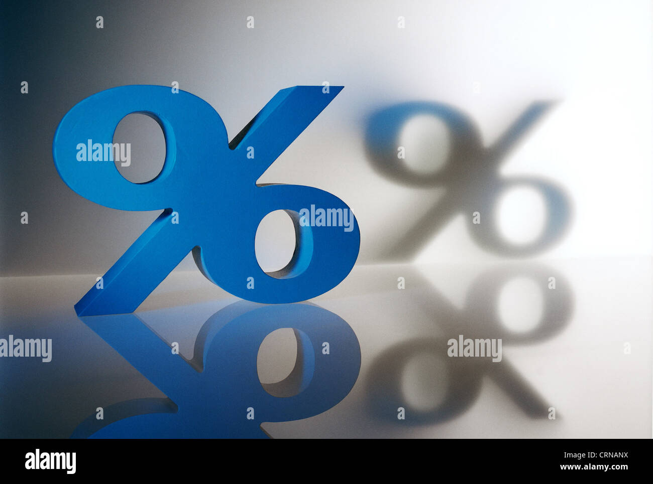 Two percent sign on a reflective surface Stock Photo - Alamy