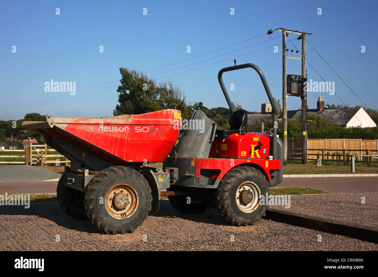 A dumper truck parked on newly constructed parking facilities at the ...
