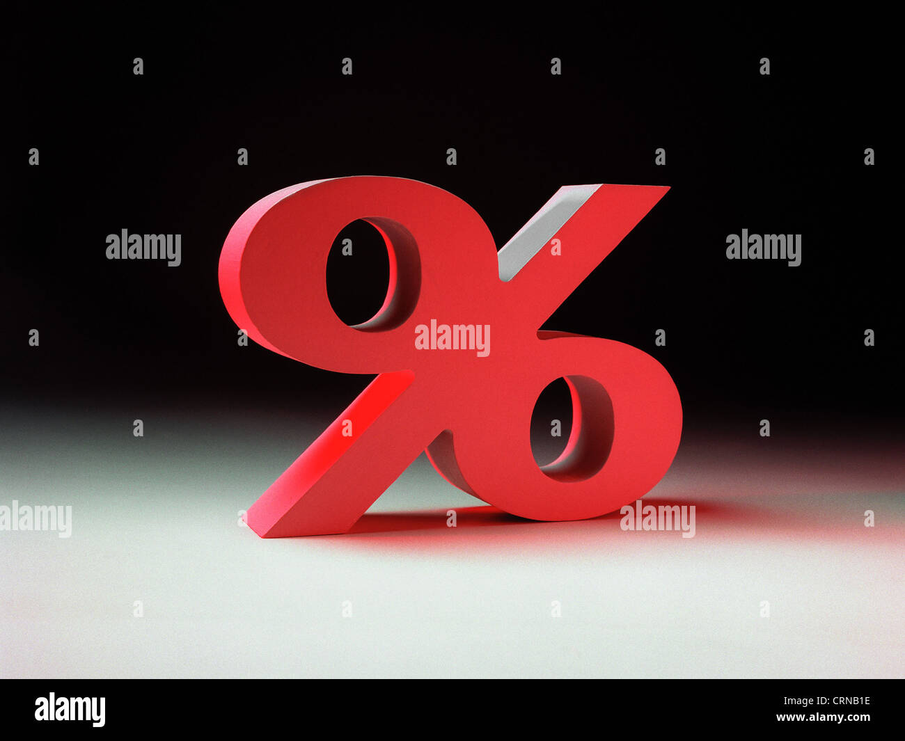 An illuminated red hatch standing percent sign Stock Photo - Alamy