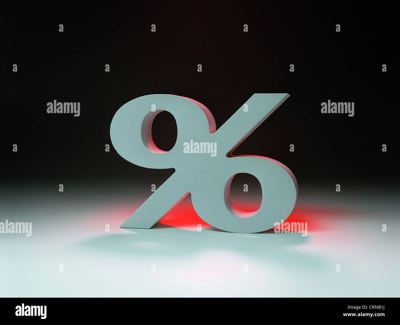 A gray percent sign on a dark background Stock Photo - Alamy