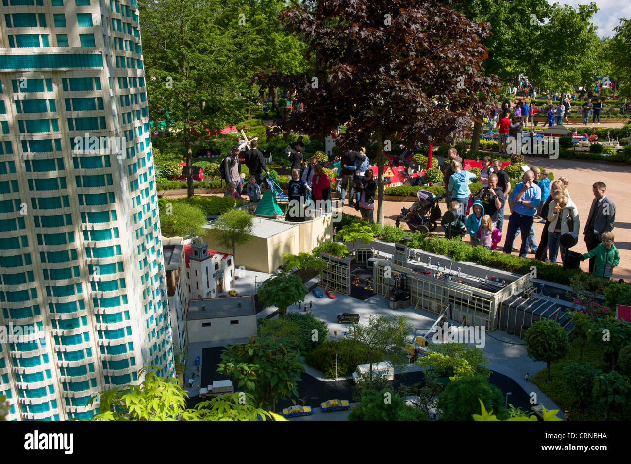 Tourists looking at Lego tower block, Miniland, Legoland, Billund ...