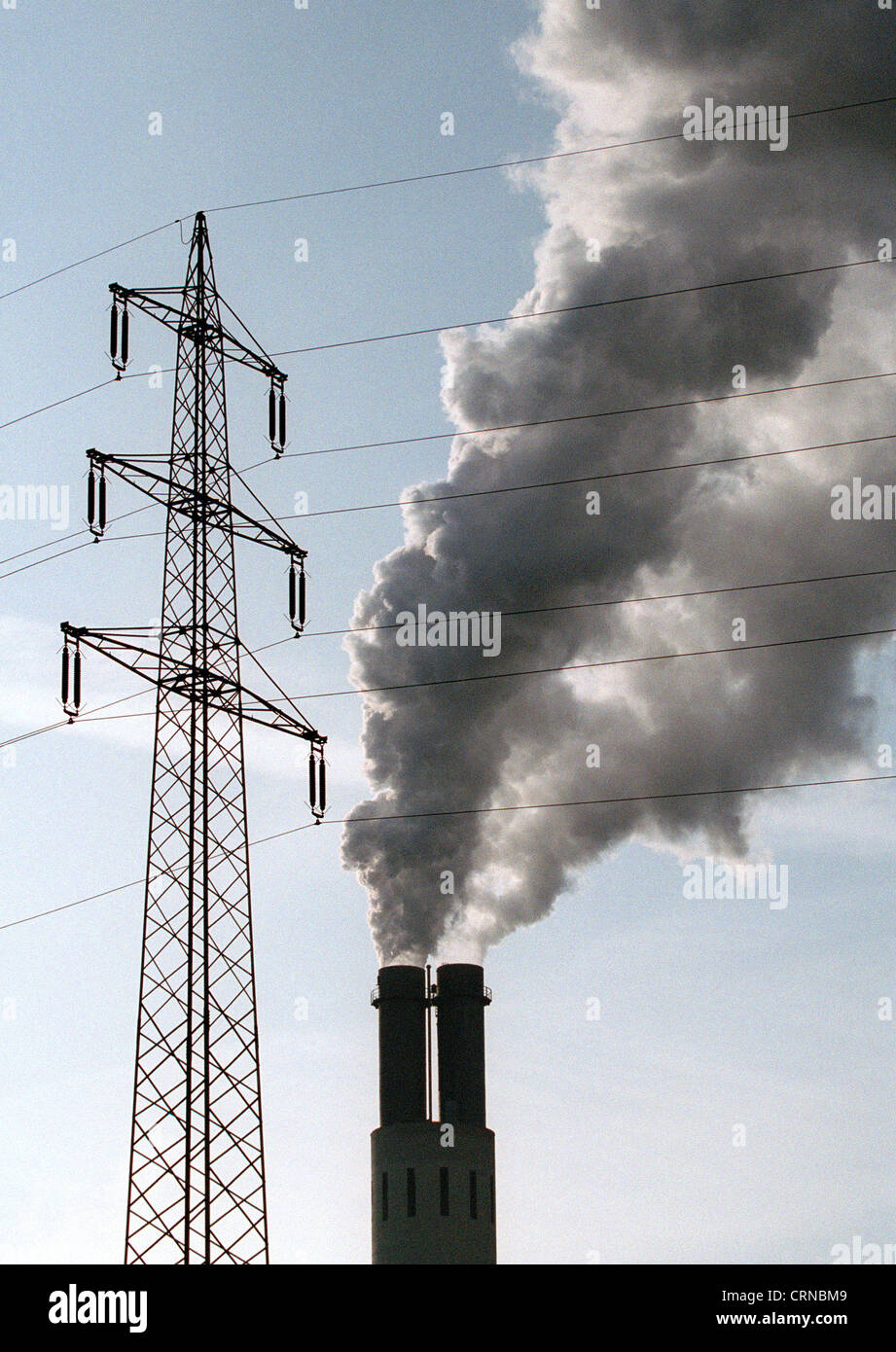 Smoking power station chimney with utility pole Stock Photo - Alamy