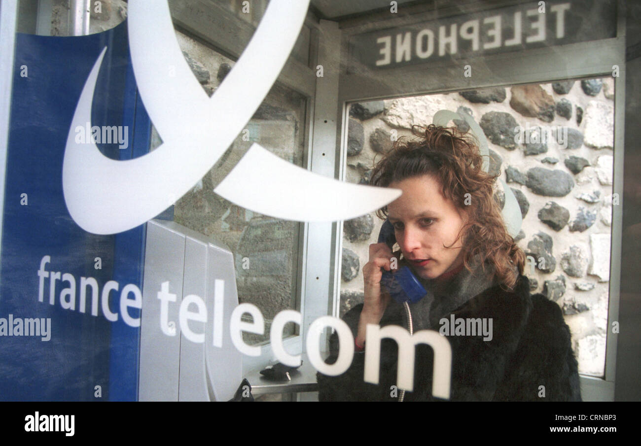French woman in the phone booth france telecom Stock Photo - Alamy