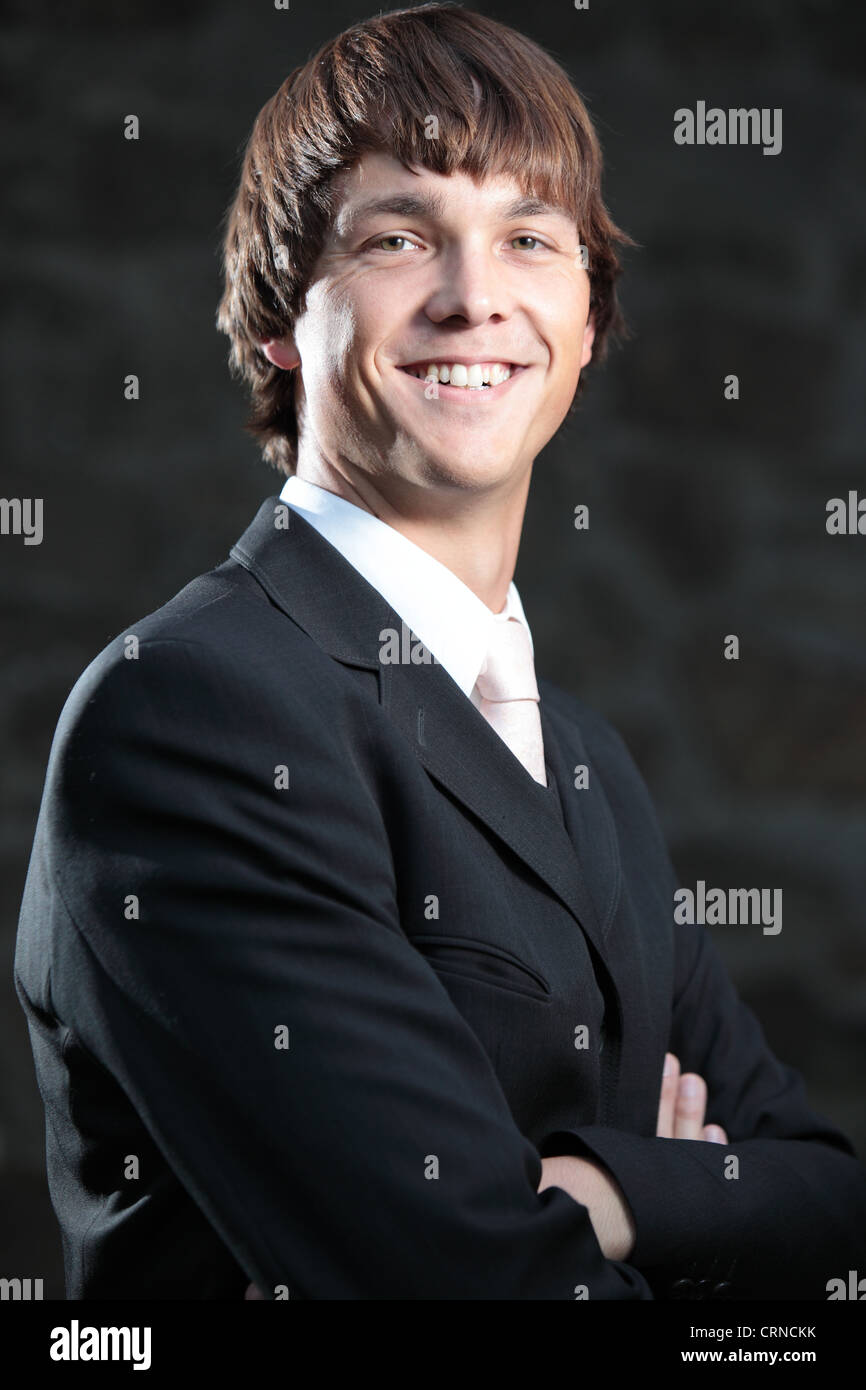 Portrait of a young handsome confident businessman Stock Photo - Alamy