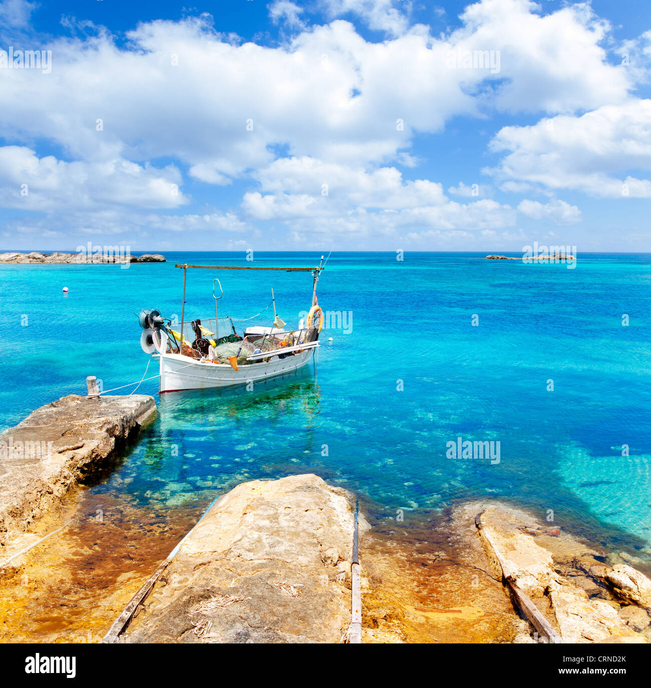 Els Pujols beach in Formentera with traditional fishing boat in summer ...