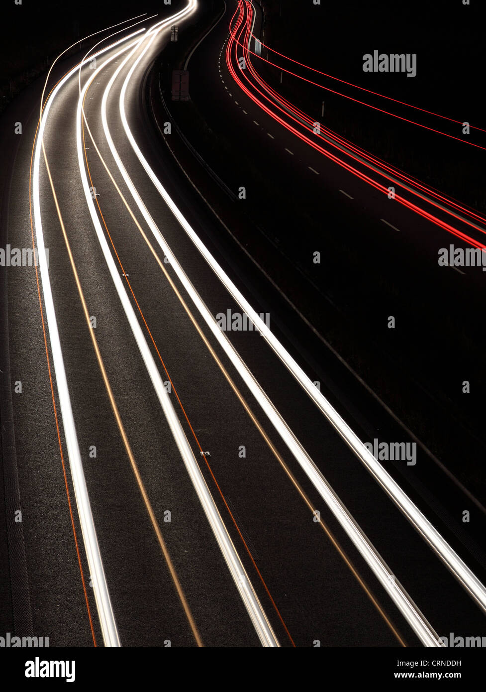 Cars moving fast on a night highway (motion blurred image Stock Photo ...