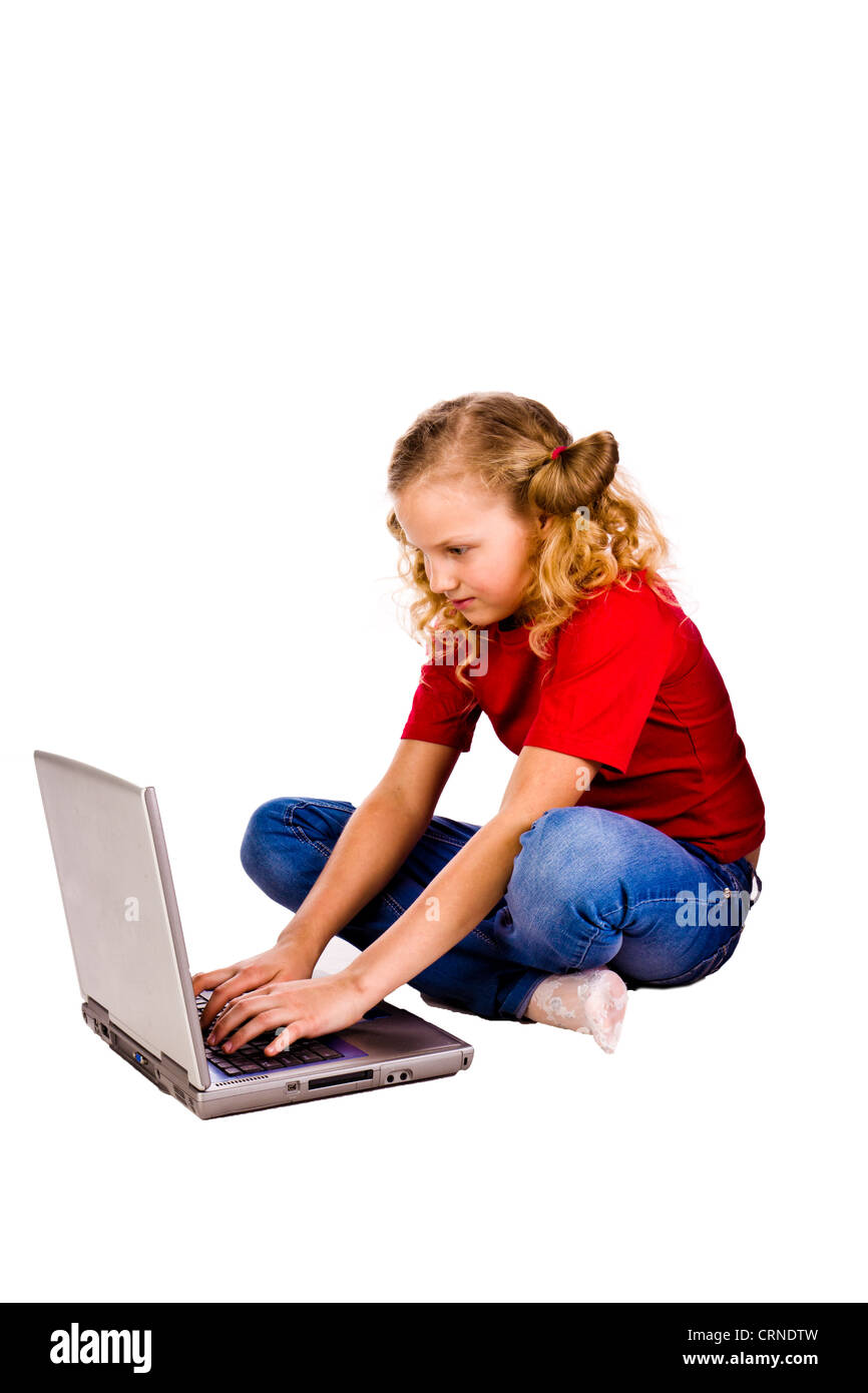 Beautiful girl sitting at the computer playing over white background ...