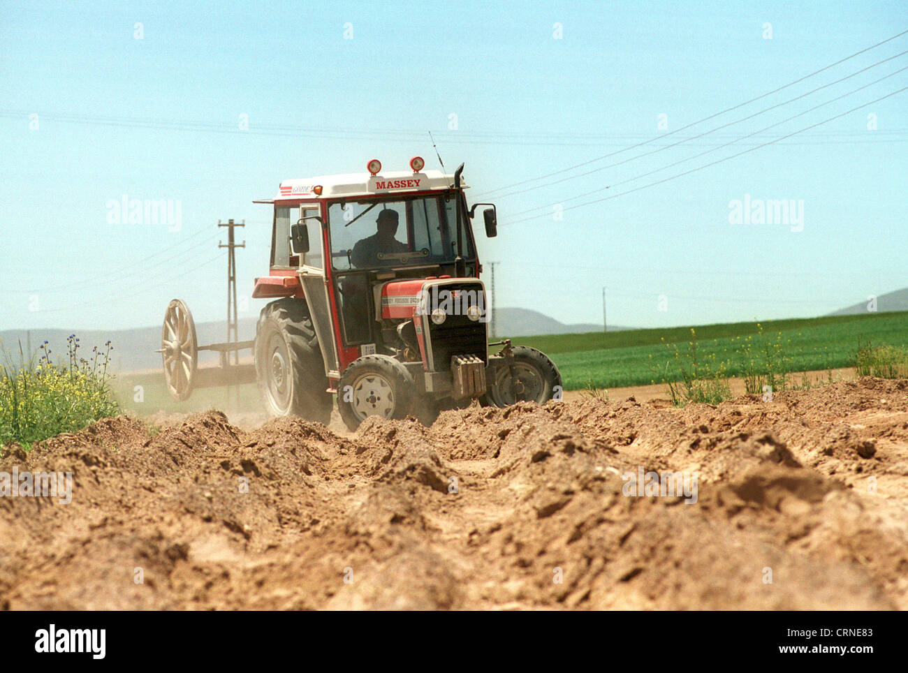 Farmer with tractor on a field, Turkey Stock Photo - Alamy
