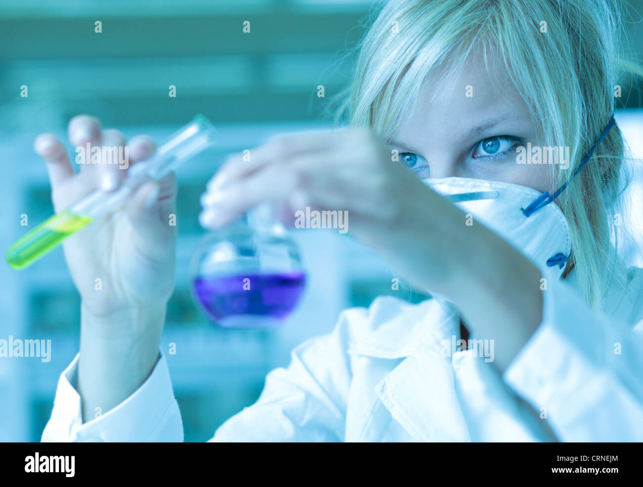 Closeup of a female researcher carrying out experiments in a lab Stock ...