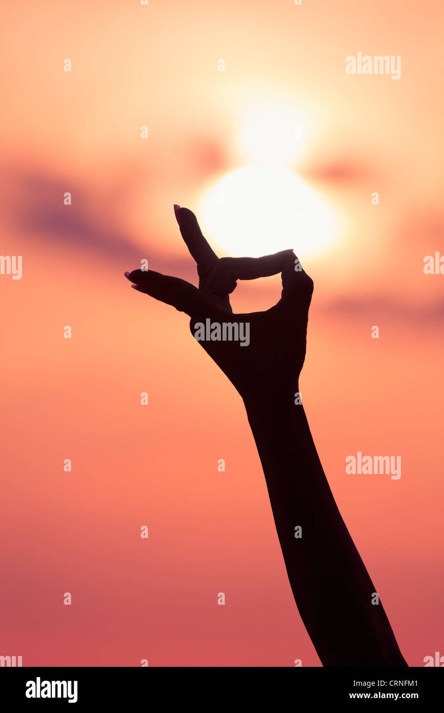 Detail of a female hand forming a Mudra gesture used in yoga practice ...