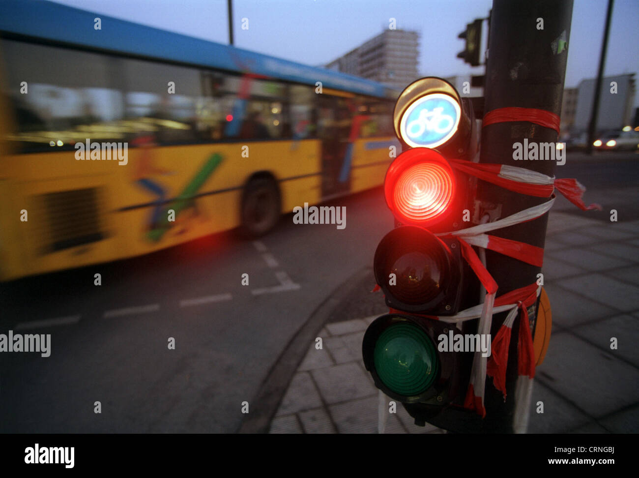 Red light and turning right gender bus at night Stock Photo - Alamy