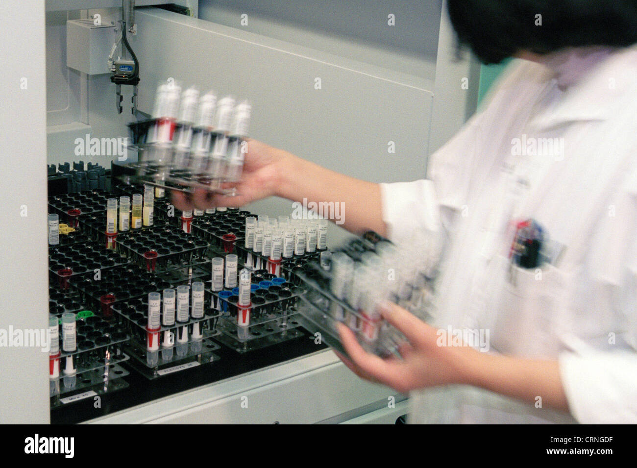 Removal of automatically sorted samples in the laboratory Stock Photo ...