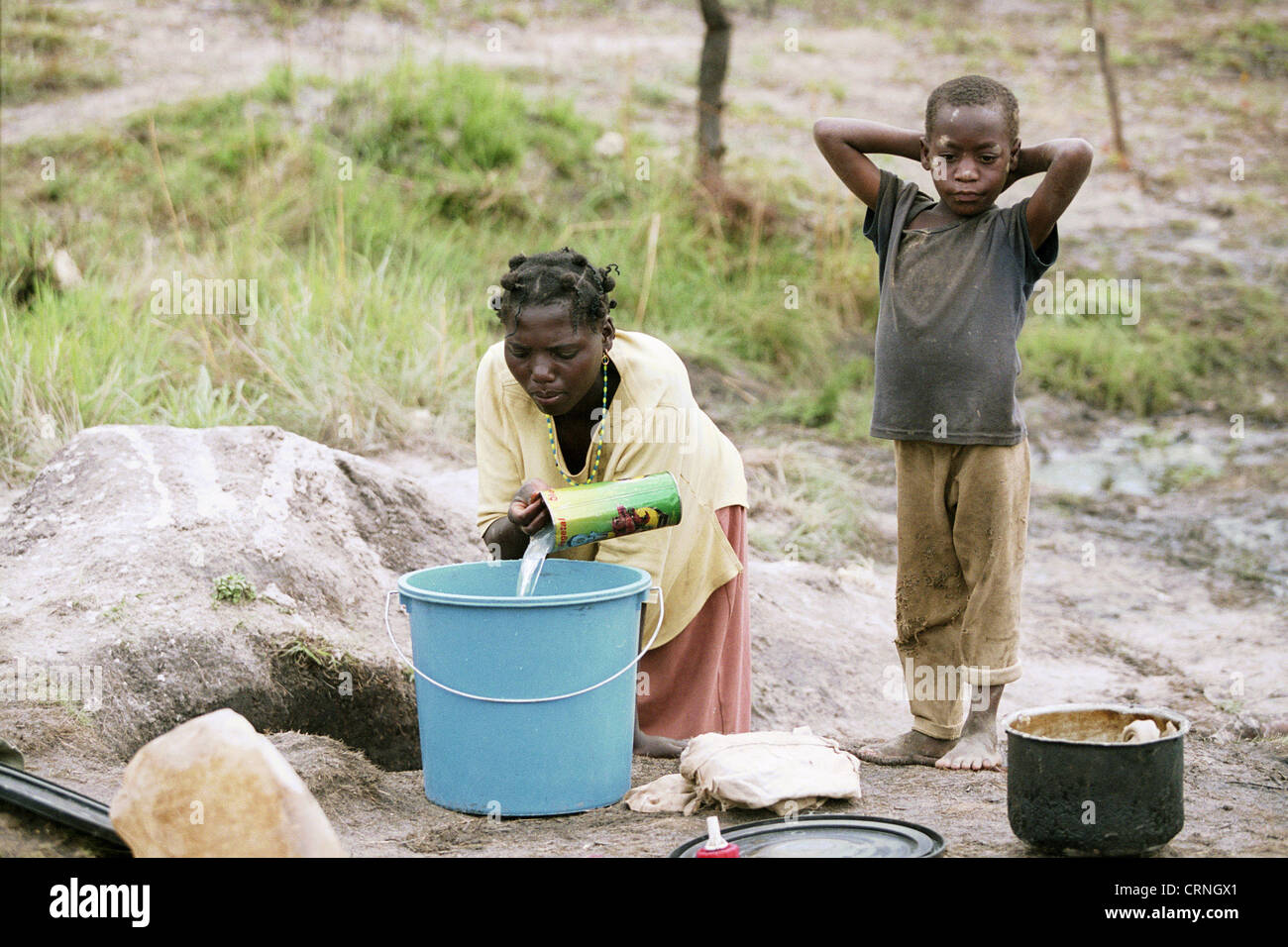 Child fetching drinking water hi-res stock photography and images - Alamy