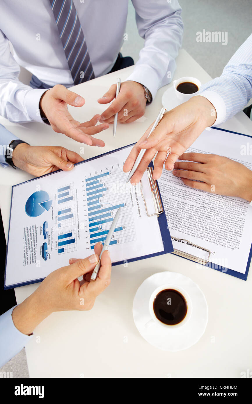 Vertical shot of a business team analyzing the highest results of the ...