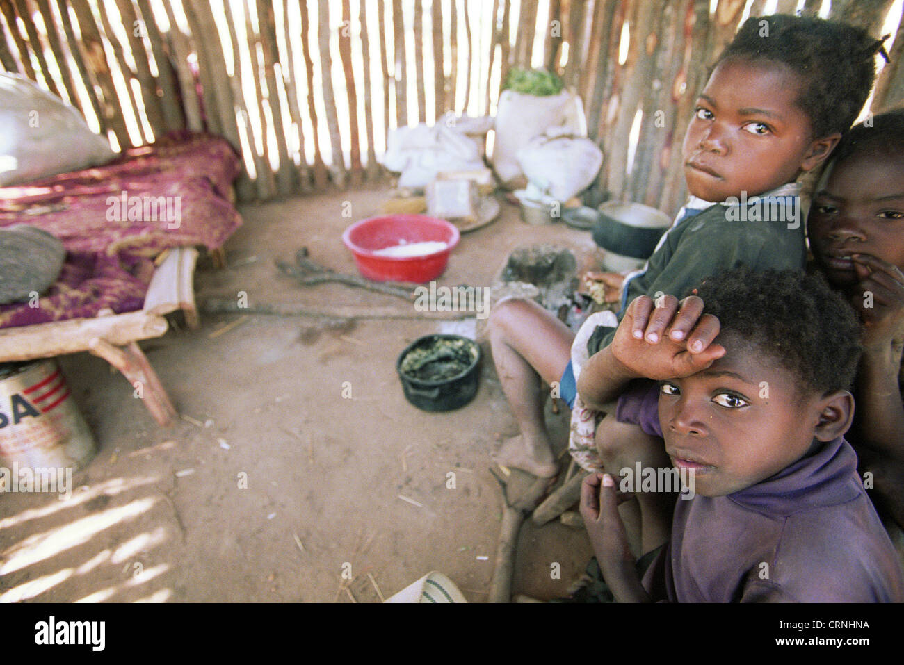 Children in a traditionally built hut Stock Photo - Alamy