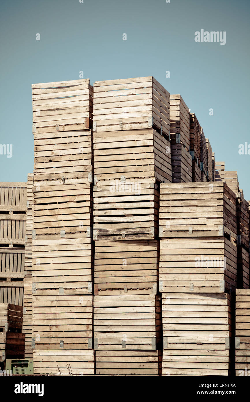 Grunge Crates stack. weathered wooden boxes in tall rows. Vignetted ...