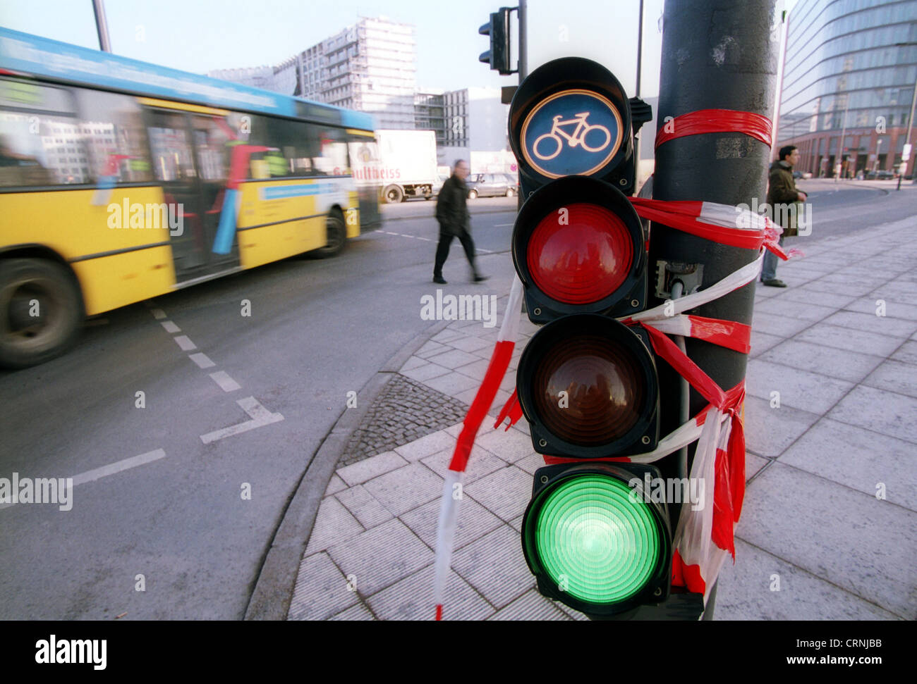 Green traffic lights, pedestrians and bus turning right gender Stock ...