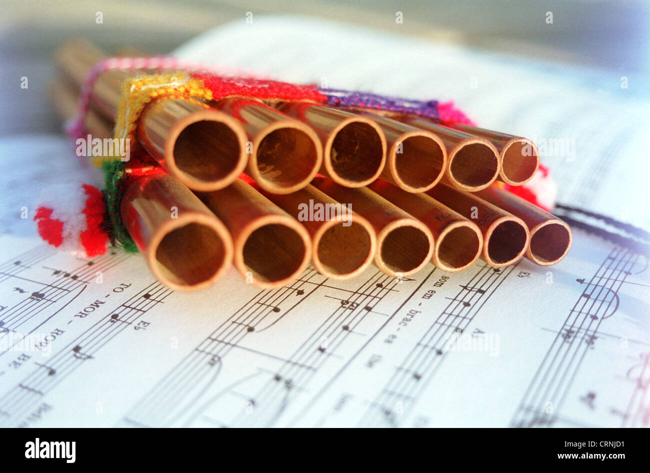 Is a pan flute on a music book Stock Photo - Alamy