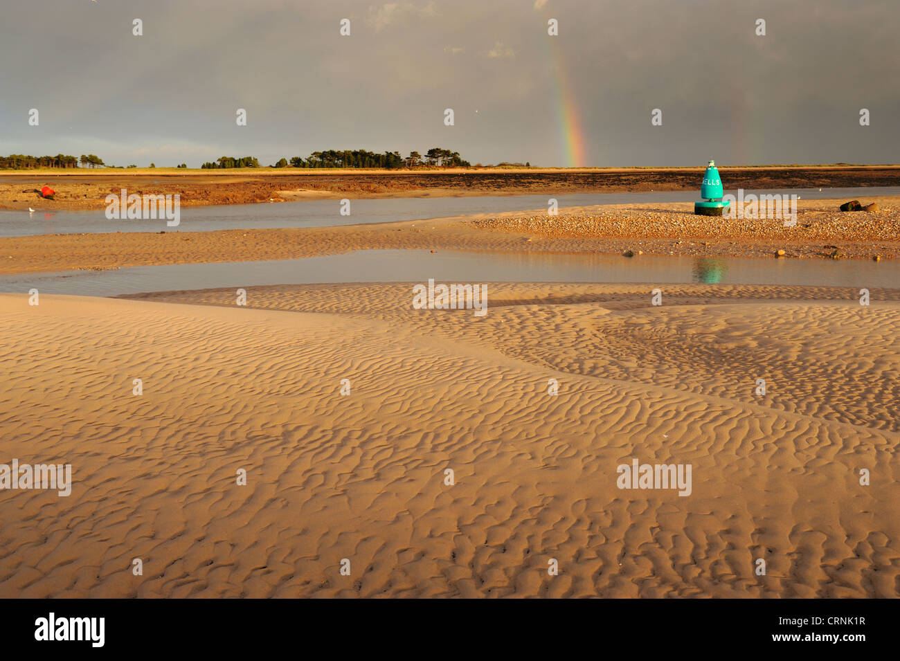 Rainbow over the 'East Hills' off Wells-next-the-sea, with sandbanks in ...