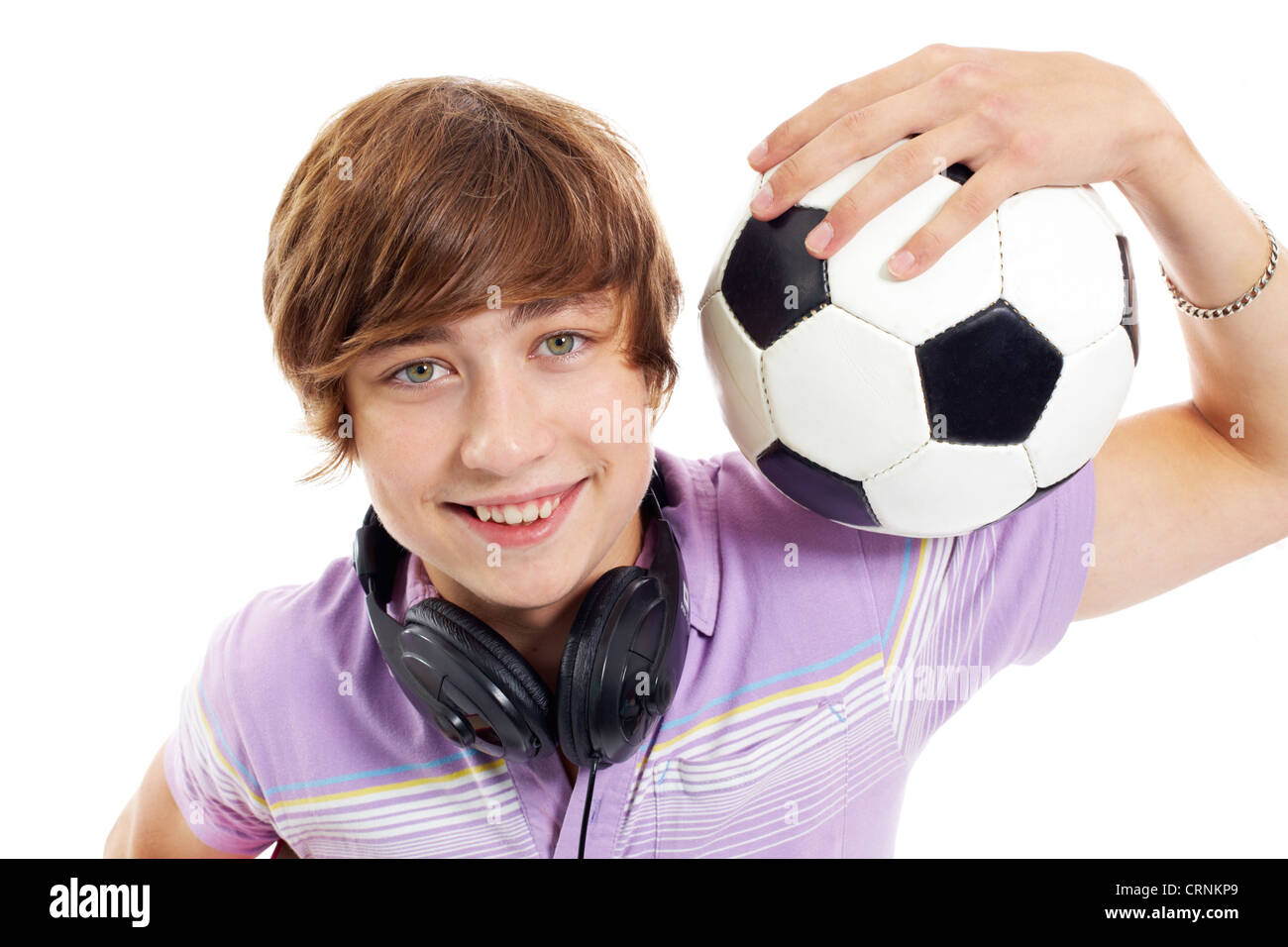 Portrait of a handsome guy holding a football Stock Photo - Alamy