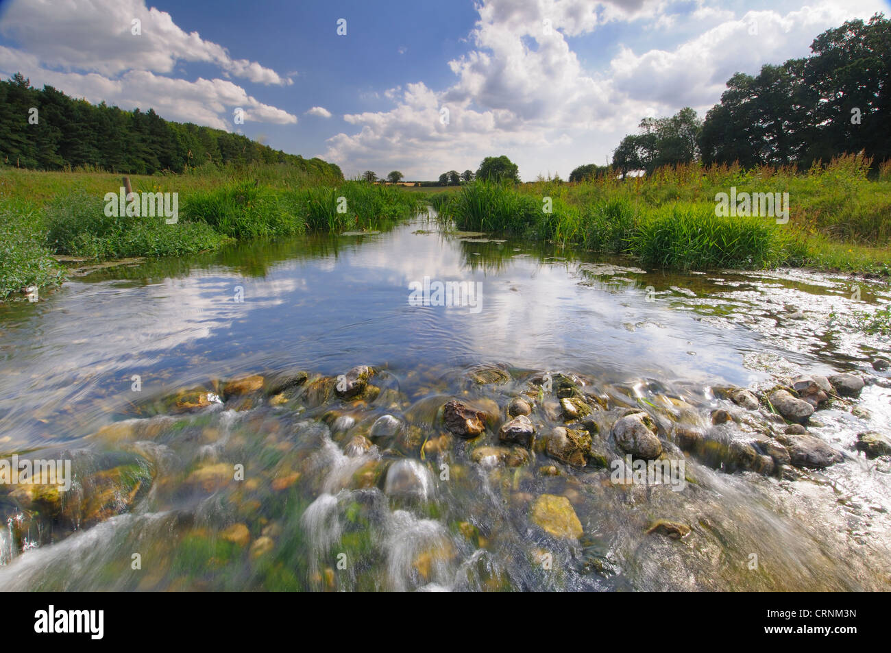 Water flowing over small rocks in the River Stiffkey Stock Photo - Alamy