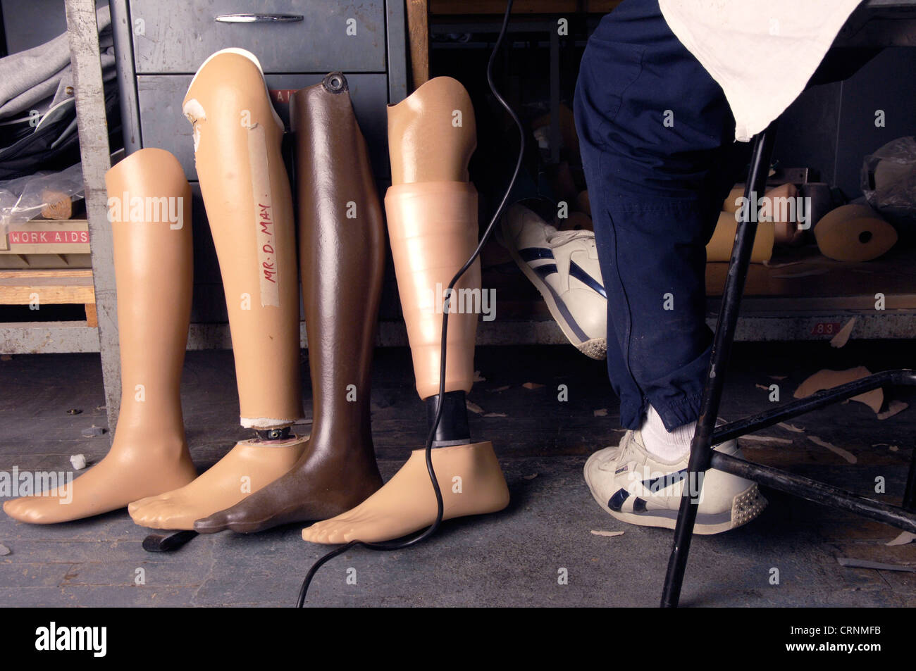 A selection of prosthetic lower legs await completion at a prosthetics ...